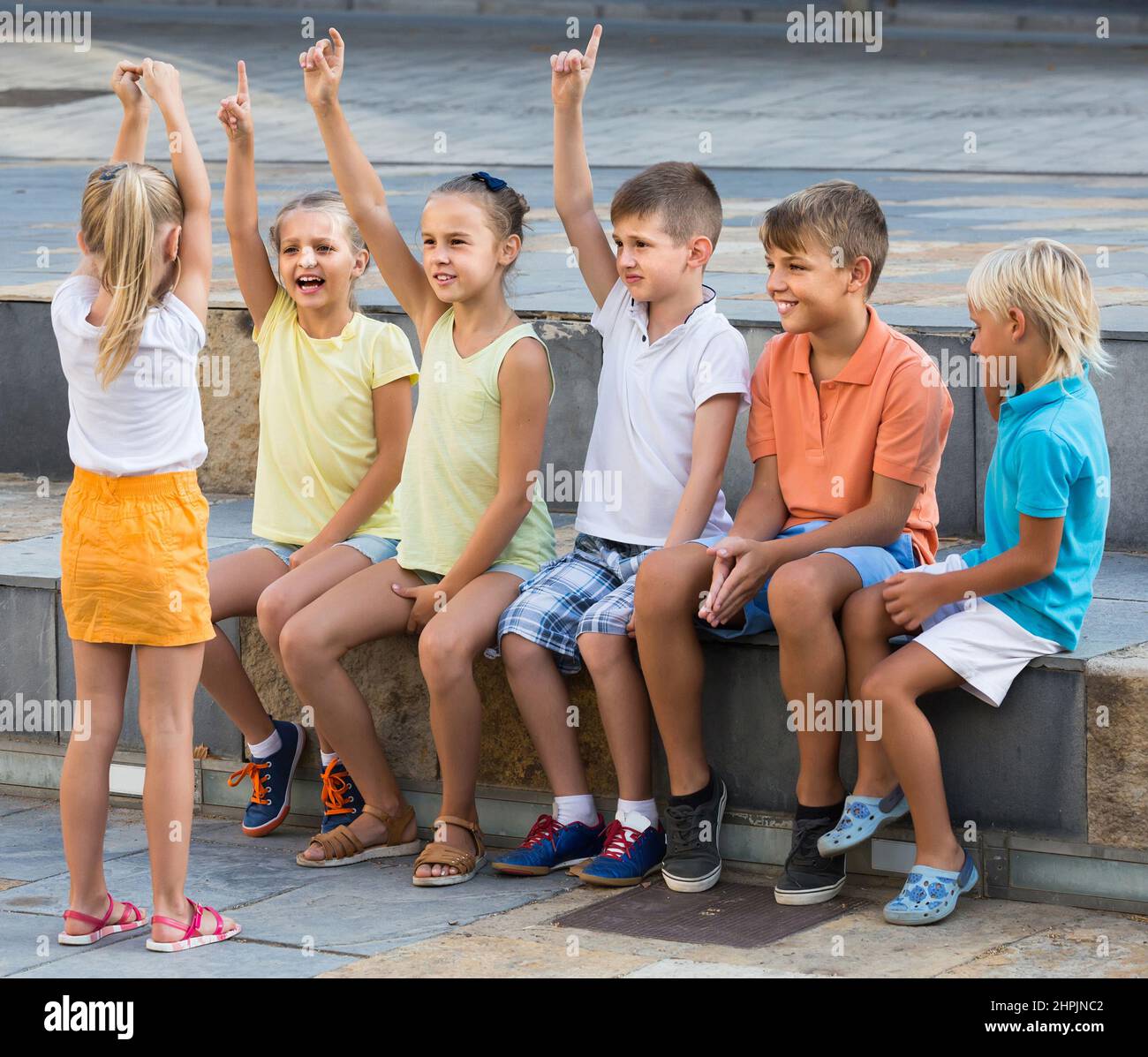 portrait of children spending time outside and playing charades Stock ...