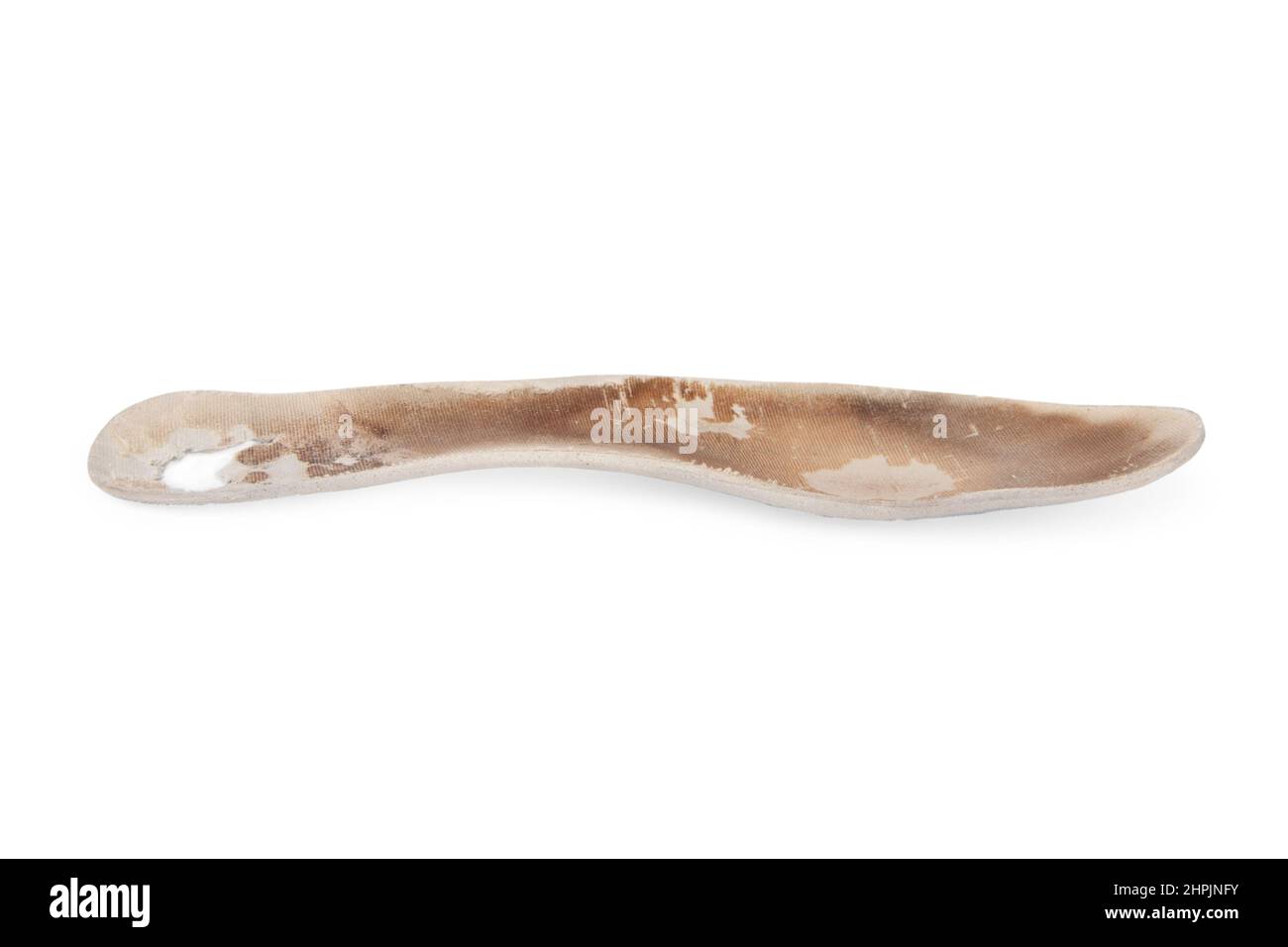 Old and shabby orthopedic insoles isolated on white background. Dirty ...