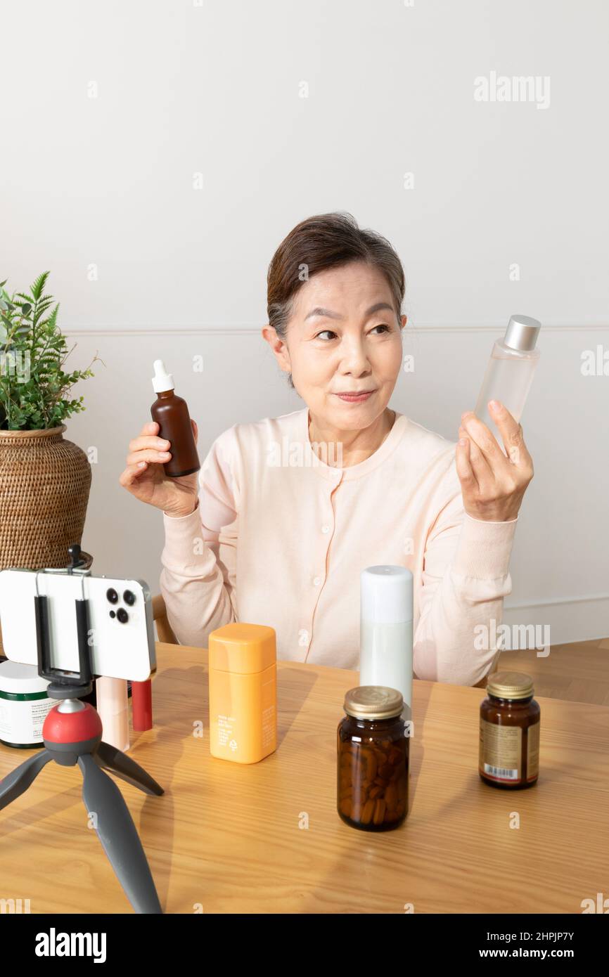 Asian Korean senior woman beauty creator, influencer, vlogger concept ...