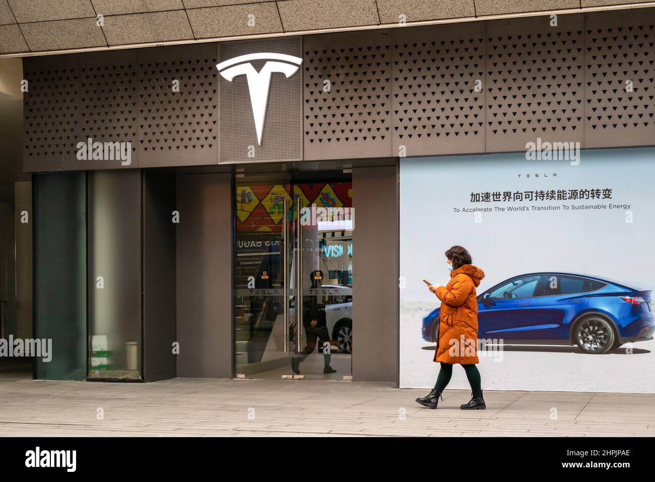 SHANGHAI, CHINA - FEBRUARY 22, 2022 - A customer passes through Tesla ...