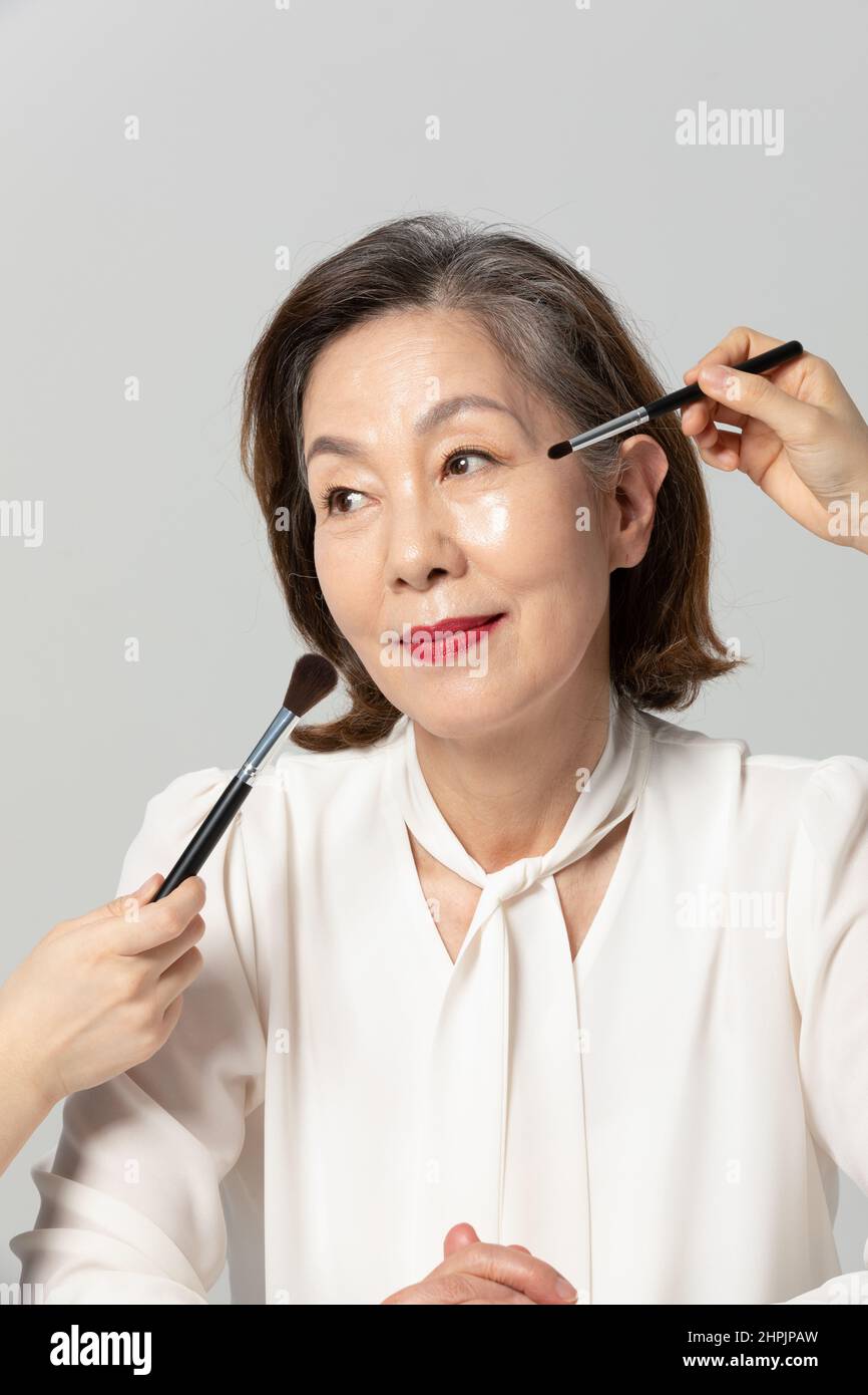 Asian Korean senior woman beauty creator, influencer, vlogger concept ...