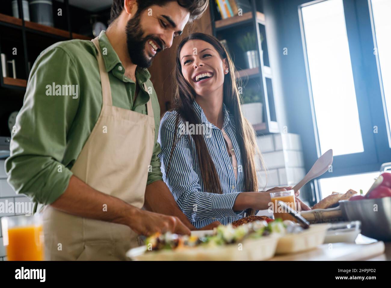 Couple cooking food happiness hobby liefstyle concept Stock Photo - Alamy