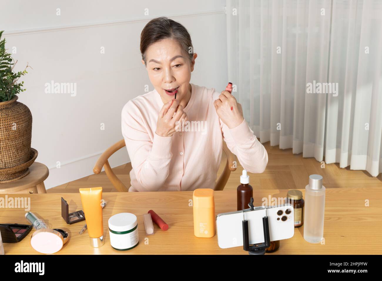 Asian Korean senior woman beauty creator, influencer, vlogger concept ...