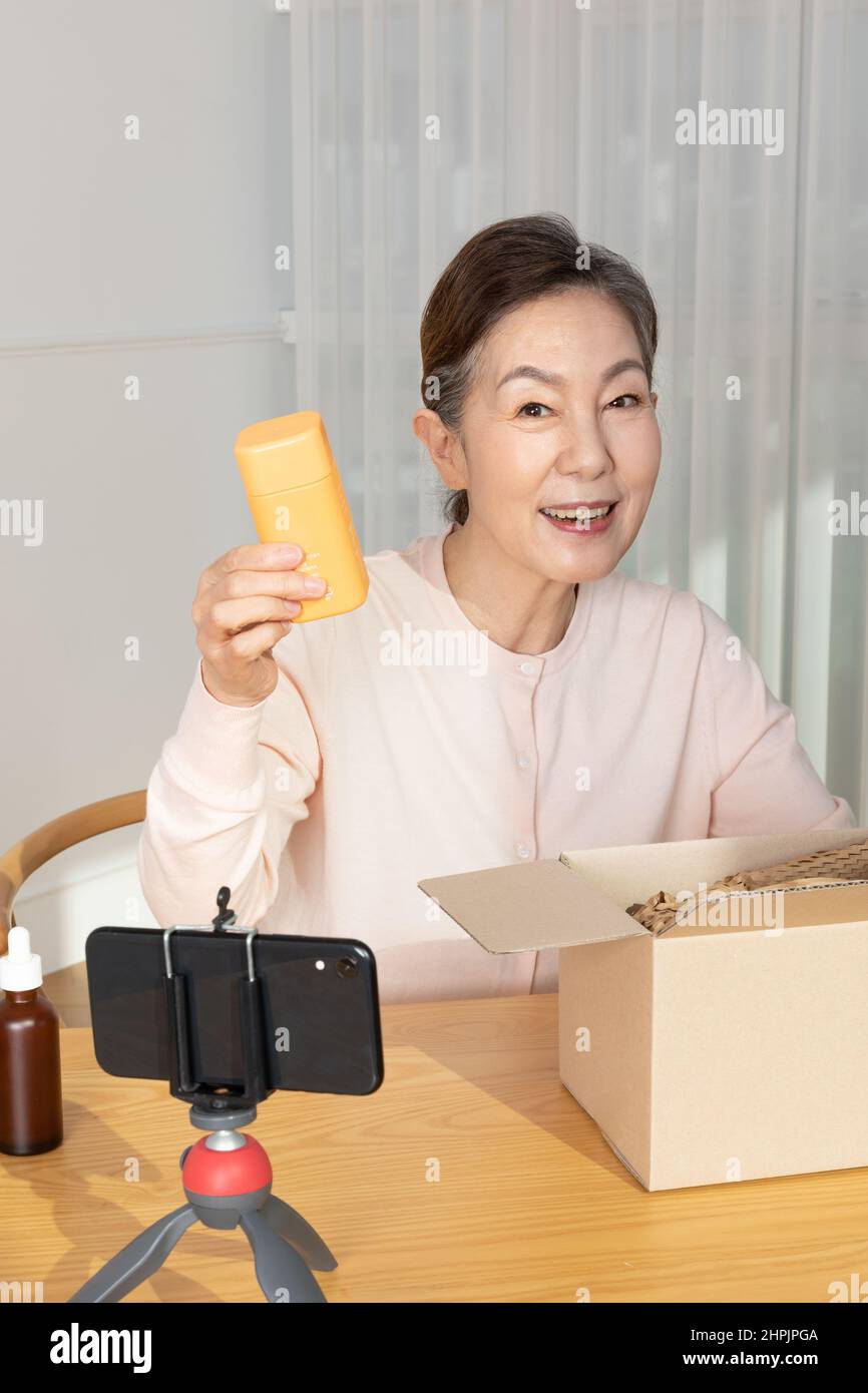 Asian Korean senior woman beauty creator, influencer, vlogger concept ...
