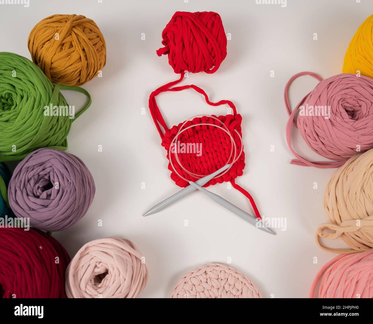 cotton yarn knitting pattern on white table Stock Photo - Alamy