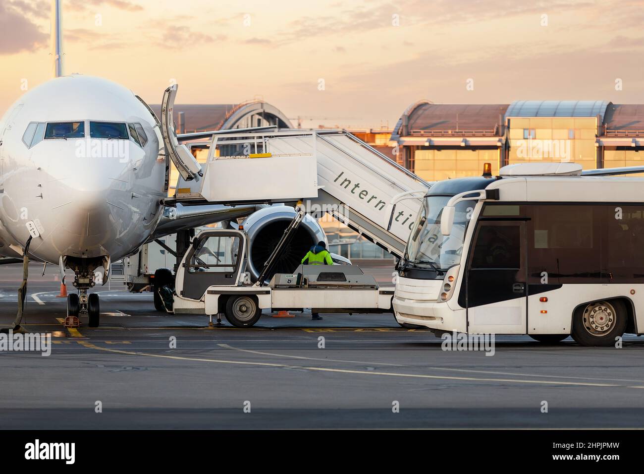 Front view big modern passenger aircraft approach boarding witth stairs ...