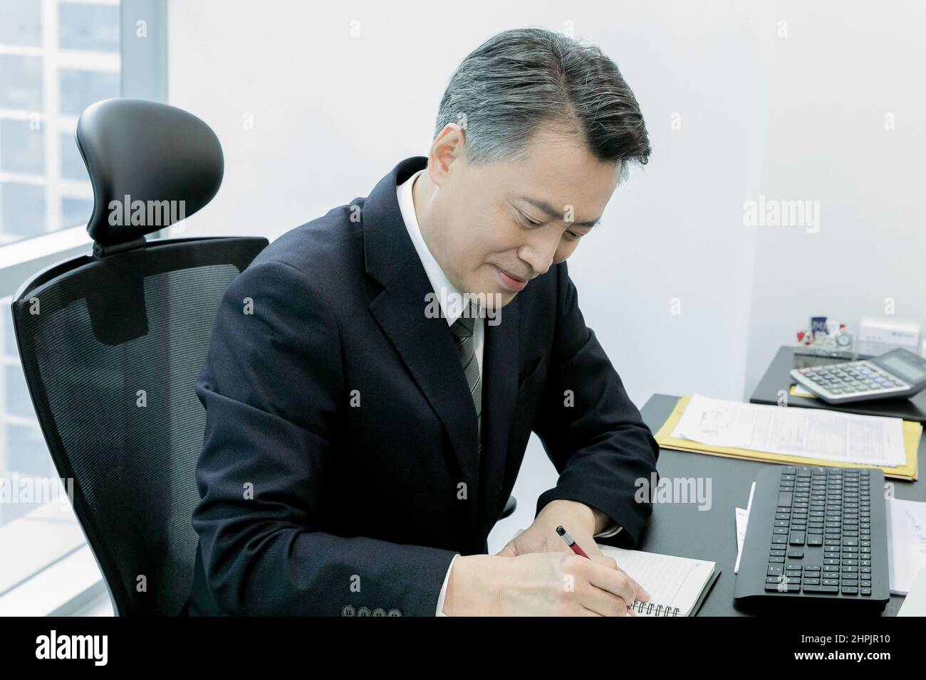 business concept asian korean man taking notes Stock Photo - Alamy