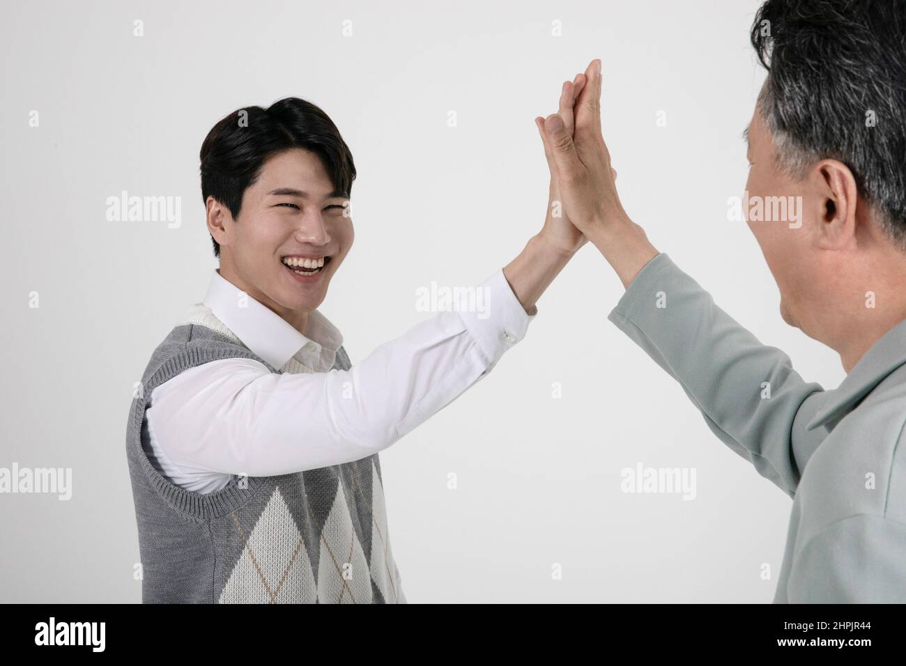 Making high five two hi-res stock photography and images - Alamy