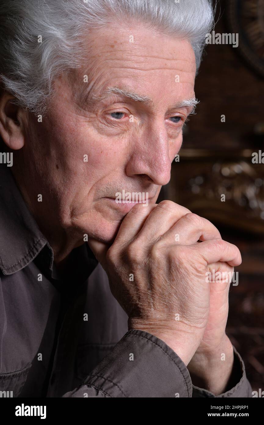 Portrait of a sad thinking senior man Stock Photo - Alamy