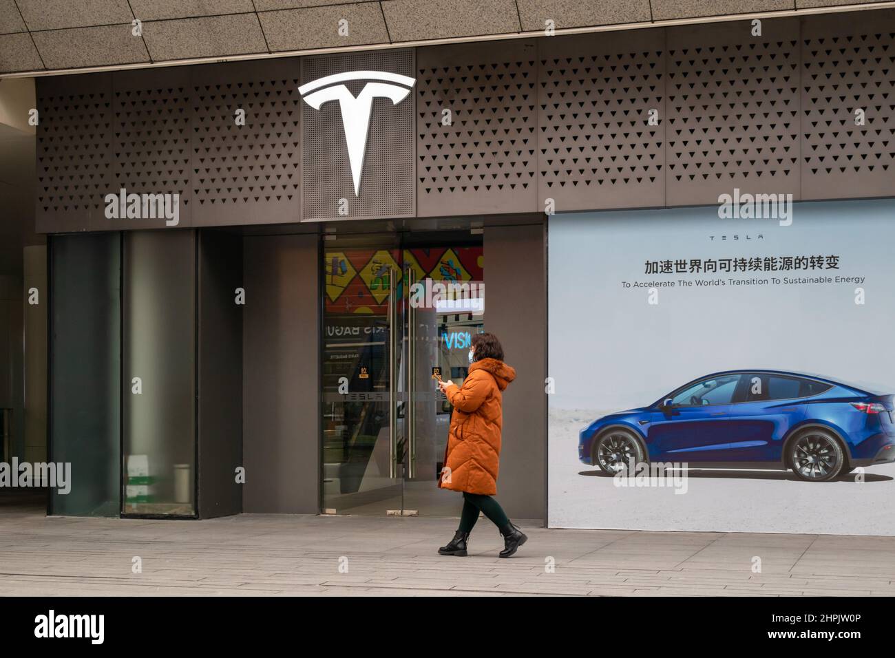 SHANGHAI, CHINA - FEBRUARY 22, 2022 - A customer passes through Tesla ...