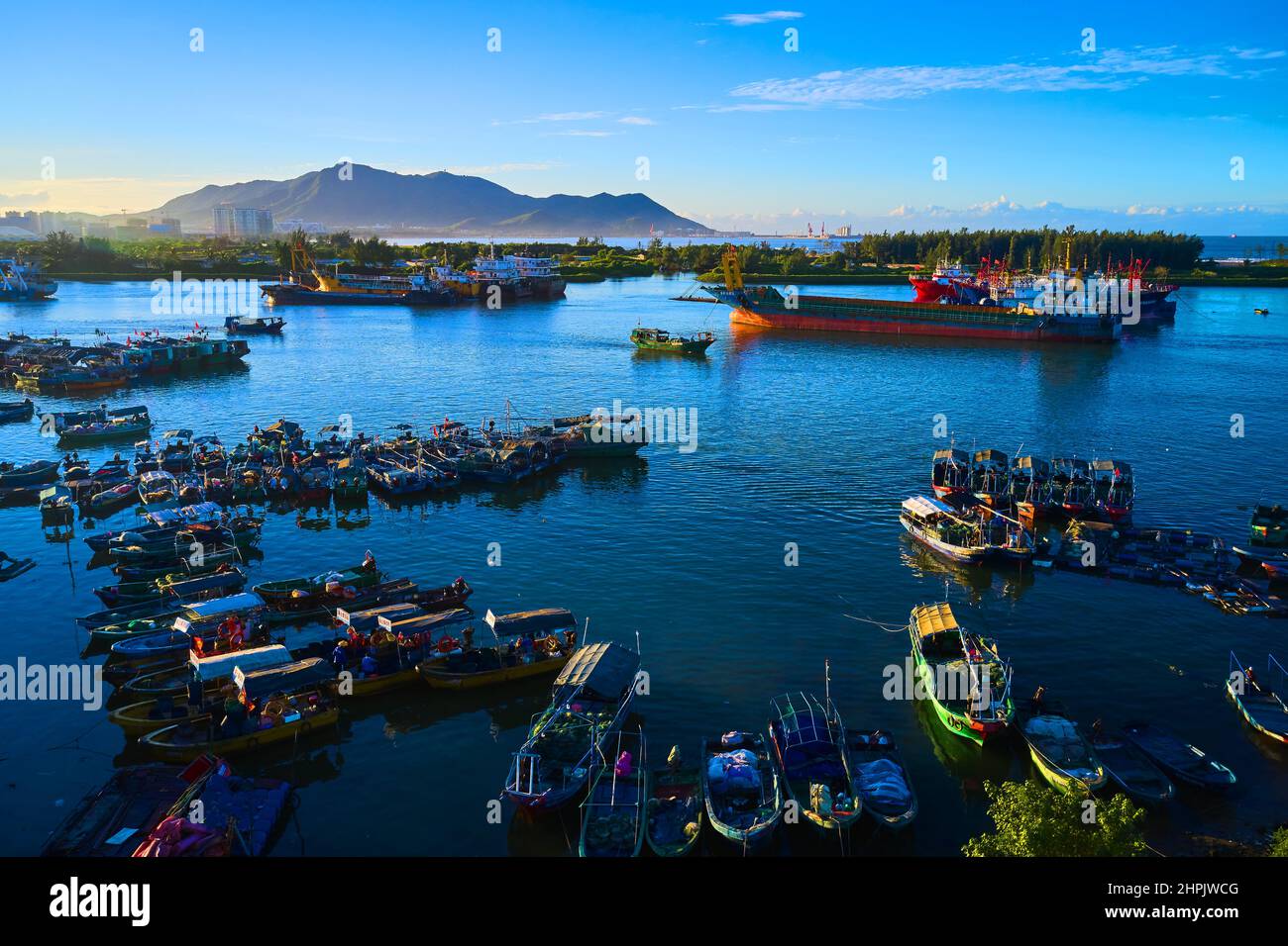 The cliff state sanya bay fishing port dawn Stock Photo - Alamy