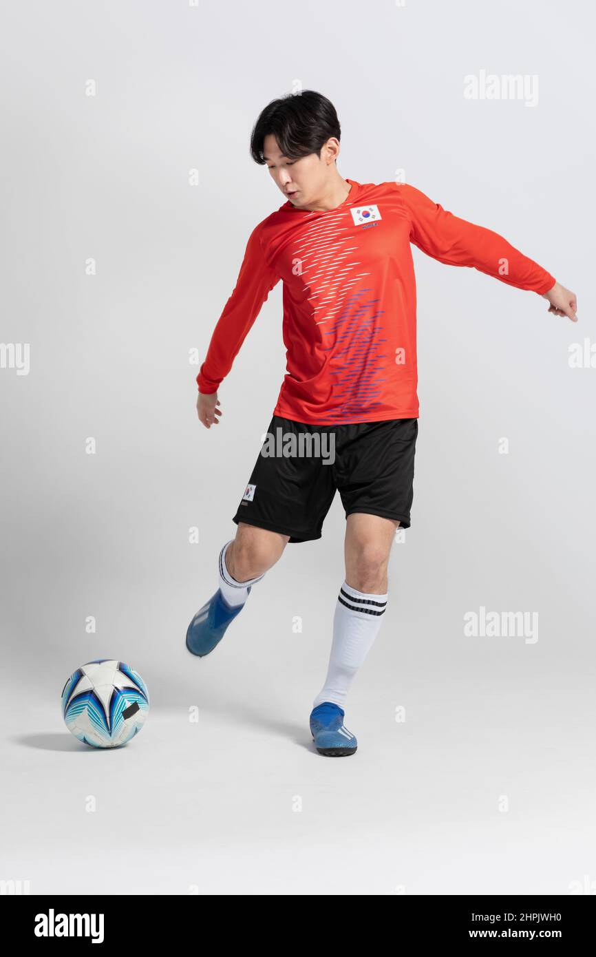 soccer football sports player, asian korean man with motions in studio ...