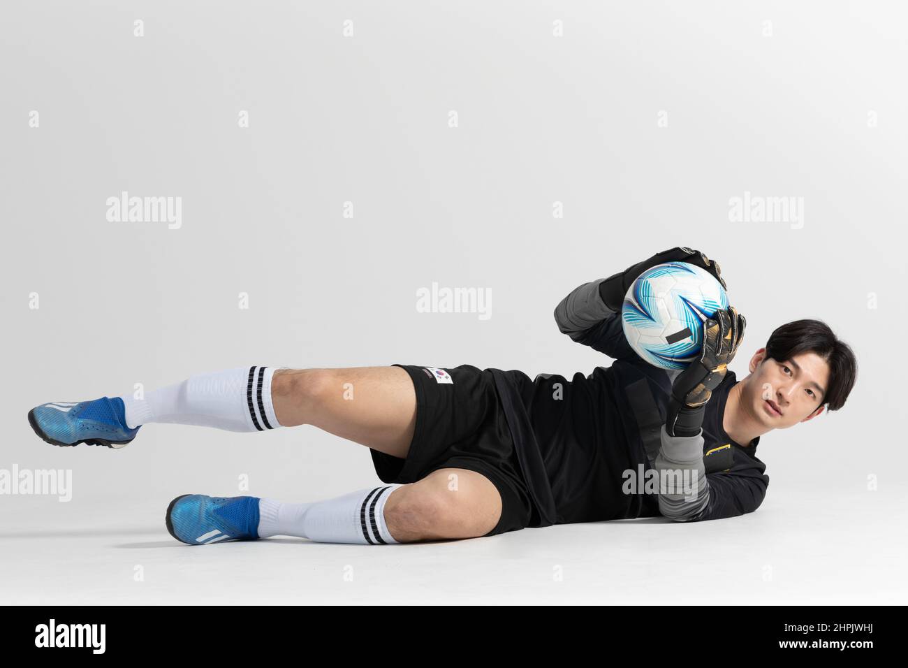 soccer football sports player, asian korean man with motions in studio ...