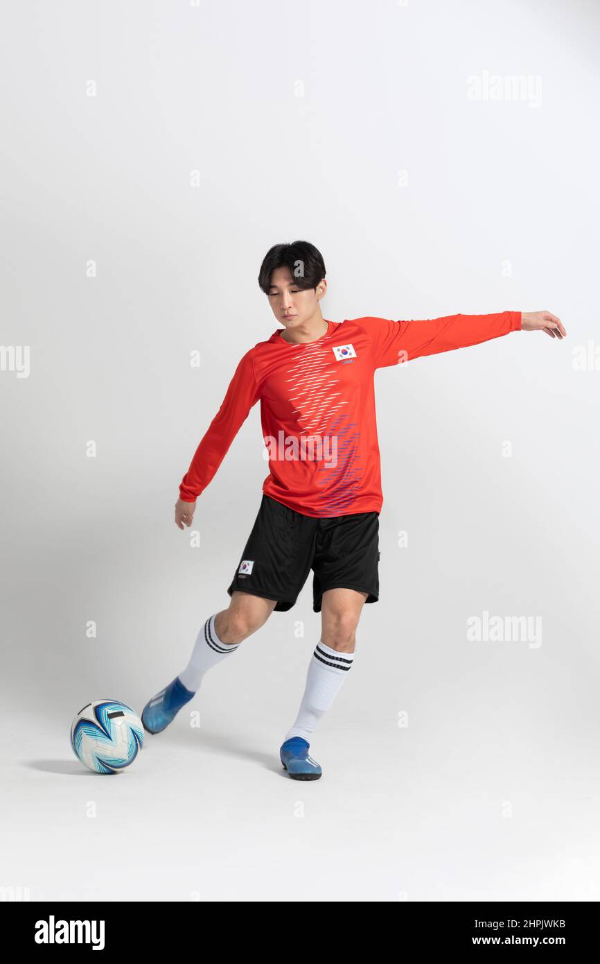 soccer football sports player, asian korean man with motions in studio ...