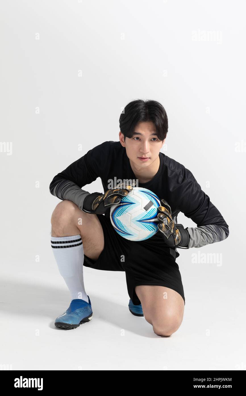 soccer football sports player, asian korean man with motions in studio ...