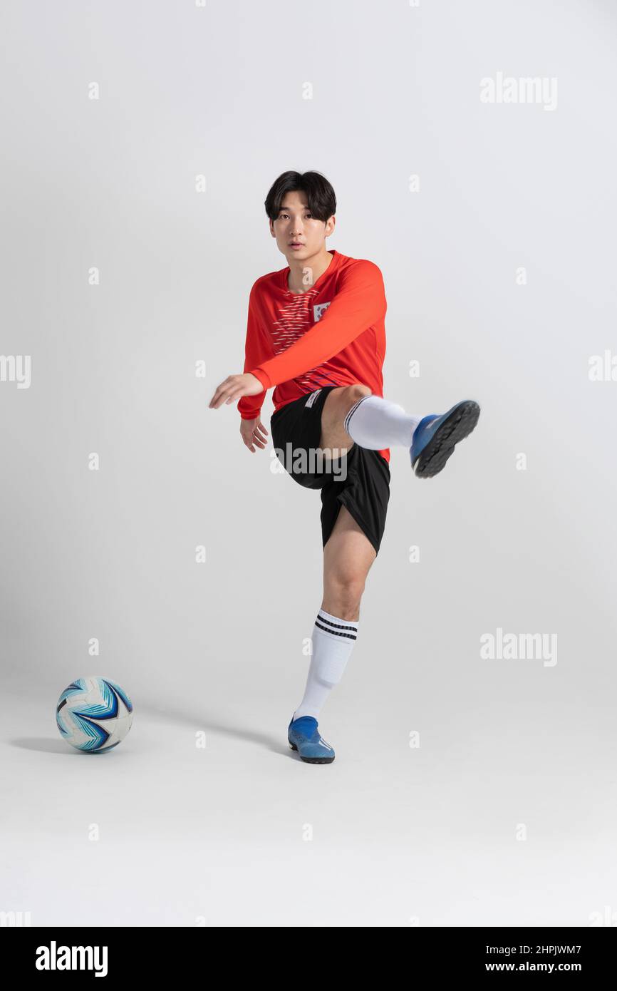 soccer football sports player, asian korean man with motions in studio ...
