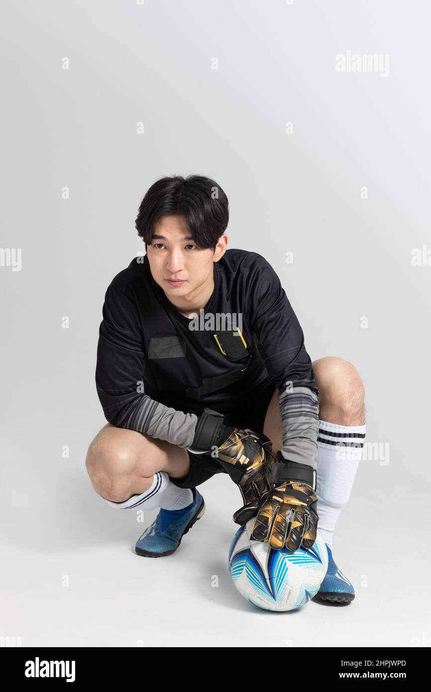 soccer football sports player, asian korean man with motions in studio ...