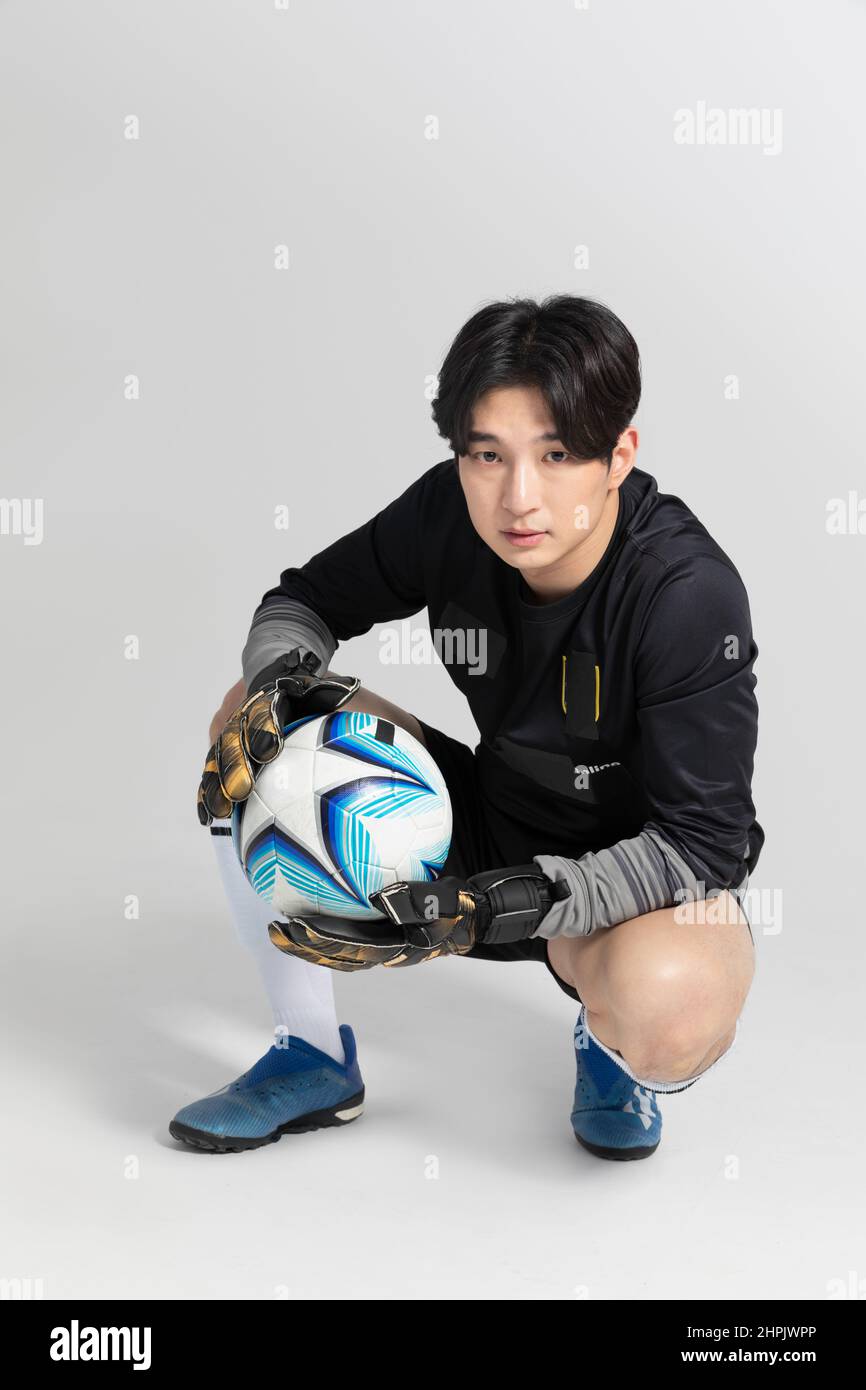 soccer football sports player, asian korean man with motions in studio ...