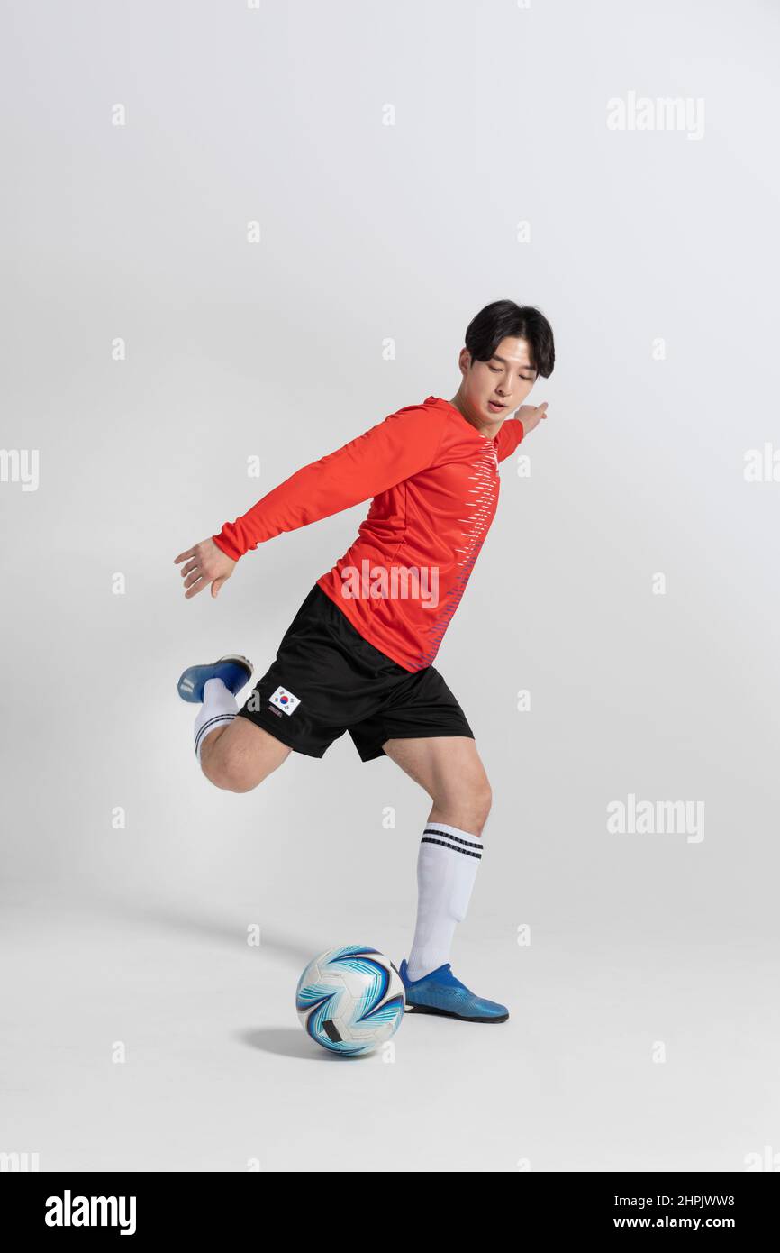 soccer football sports player, asian korean man with motions in studio ...