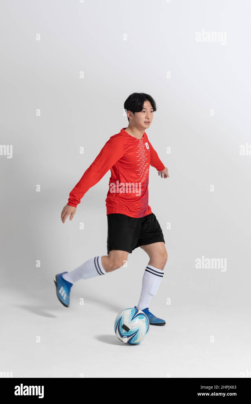 soccer football sports player, asian korean man with motions in studio ...