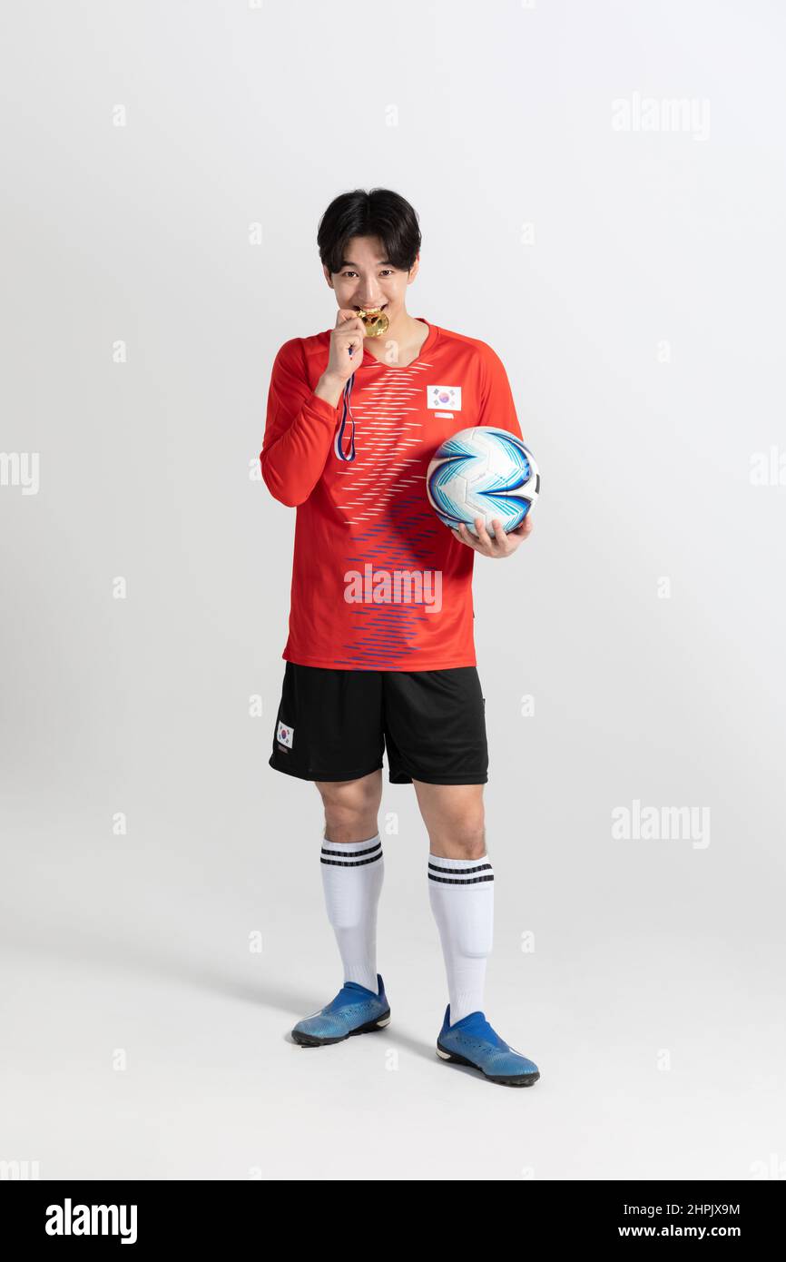 soccer football sports player, asian korean man with motions in studio ...