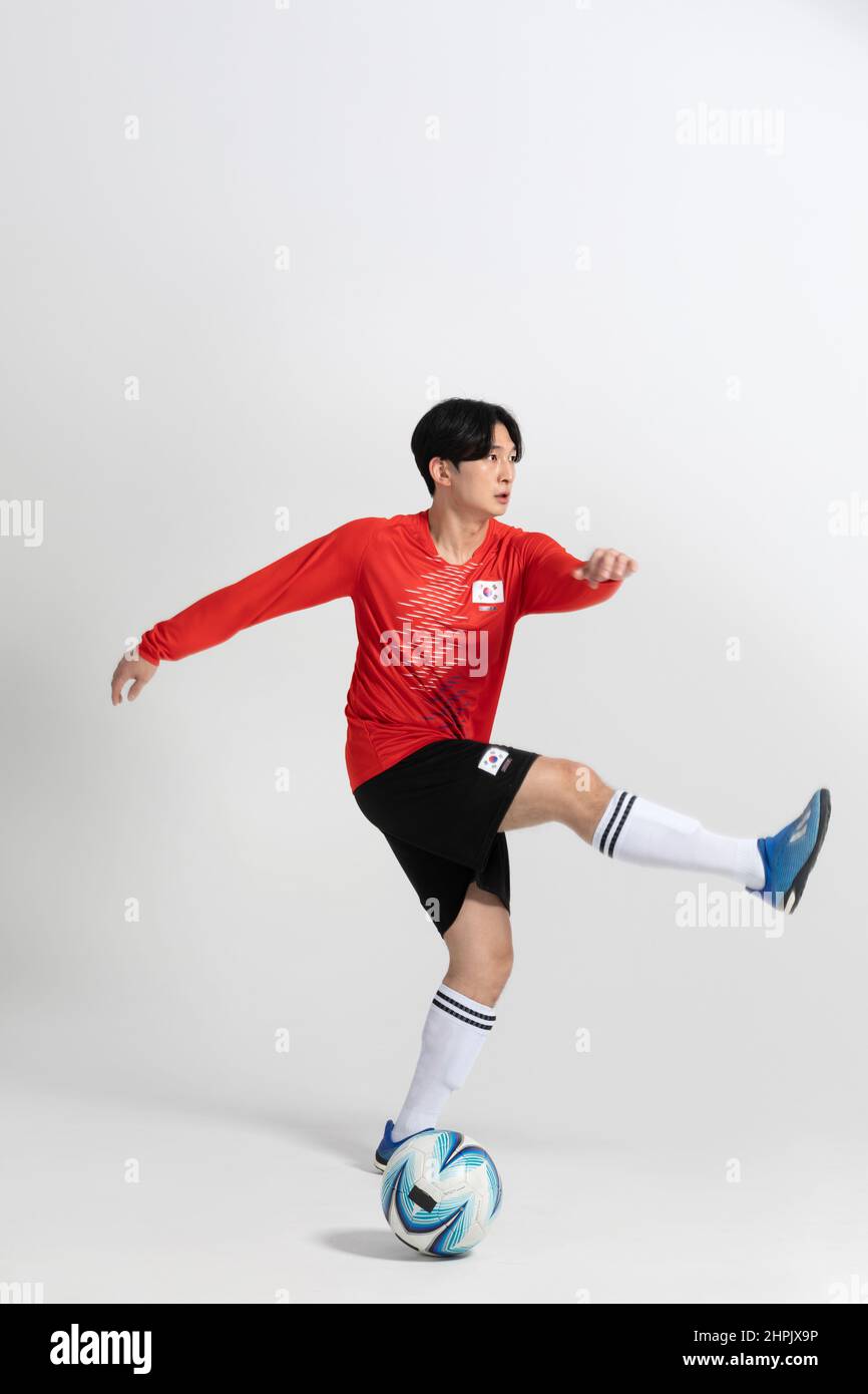 soccer football sports player, asian korean man with motions in studio ...