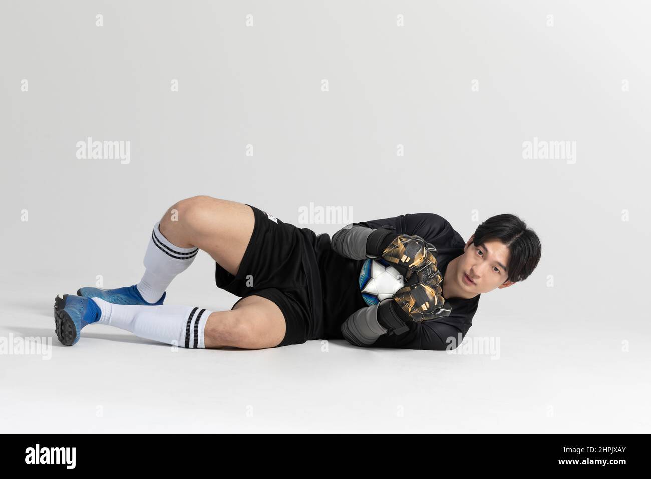 soccer football sports player, asian korean man with motions in studio ...