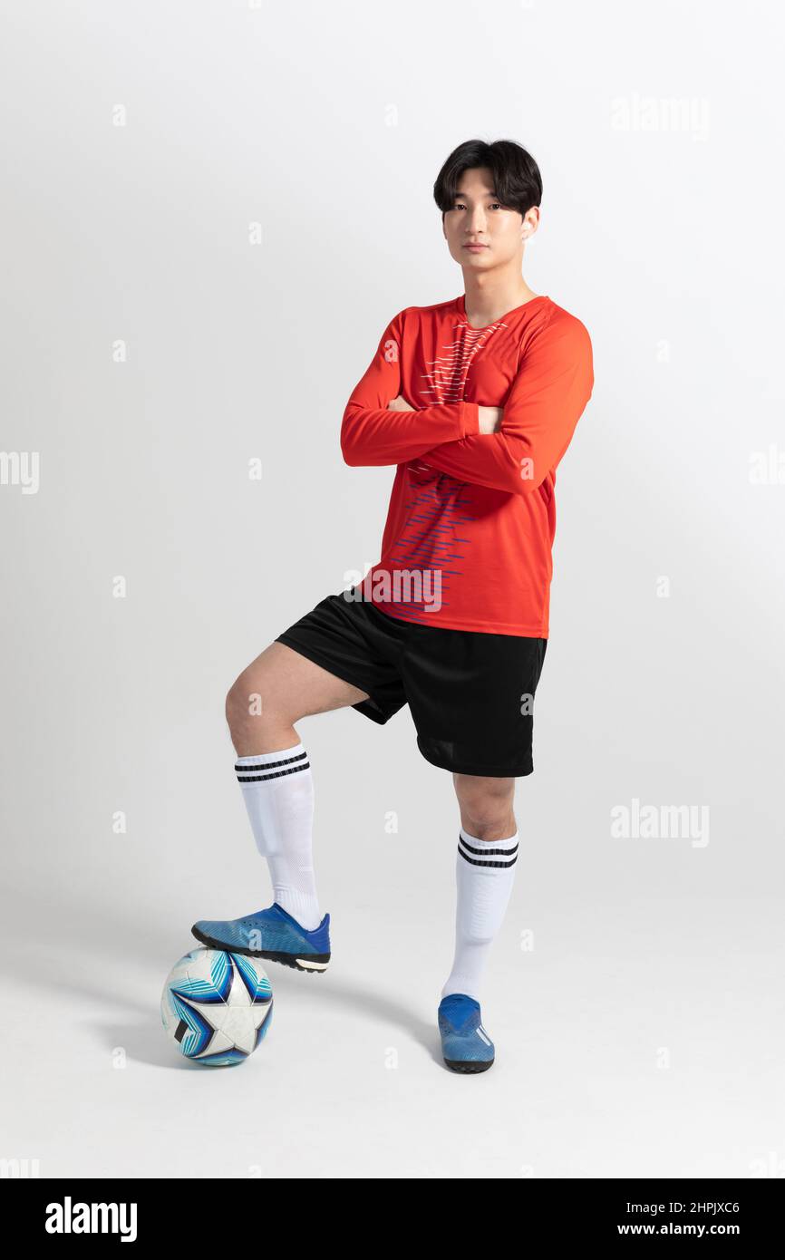 soccer football sports player, asian korean man with motions in studio ...
