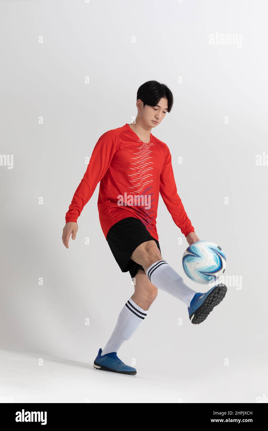 soccer football sports player, asian korean man with motions in studio ...