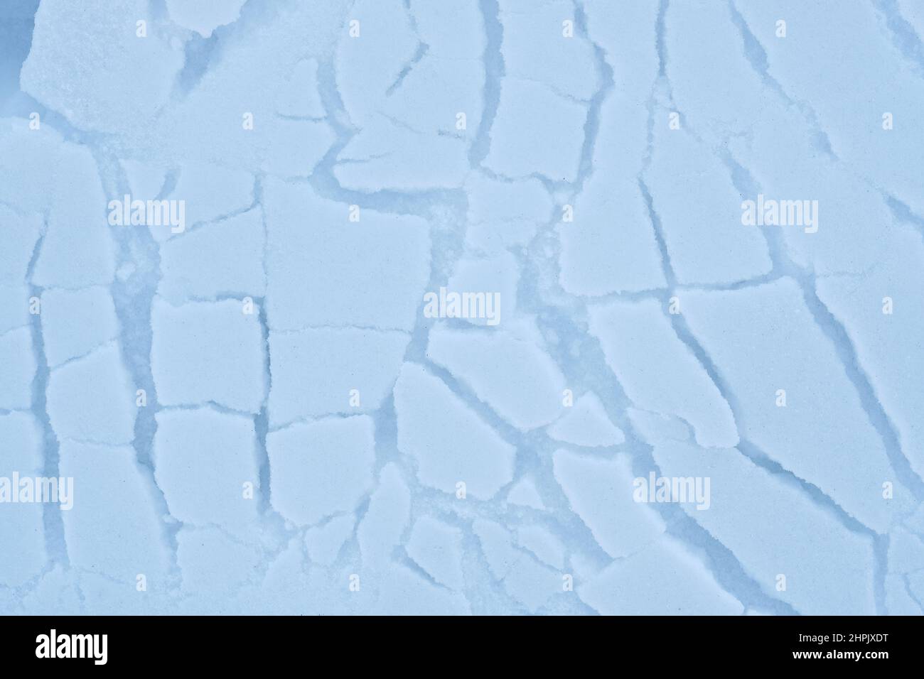 Abstract winter background texture of cracked snow Stock Photo - Alamy