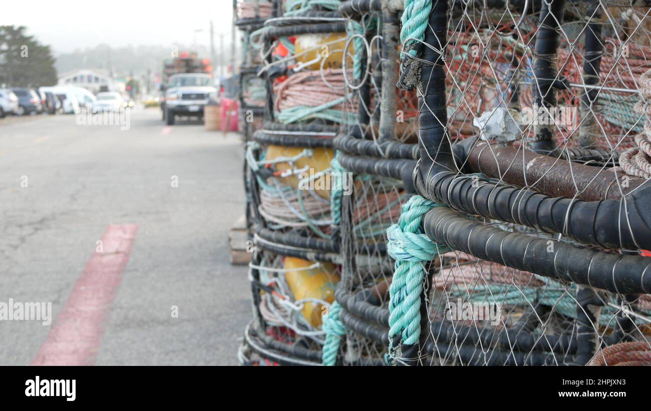 Traps, ropes and cages on pier, commercial dock, fishing industry ...