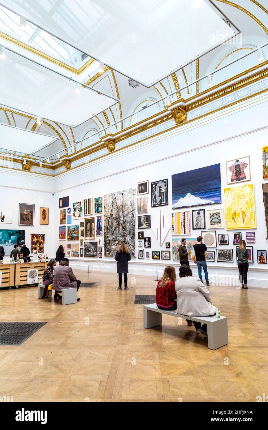 Visitors looking at art at the RA Summer Exhibition 2021, London, UK ...