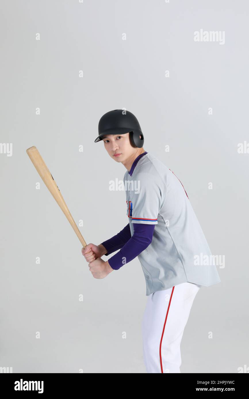 baseball sports player, asian korean man with bat Stock Photo - Alamy