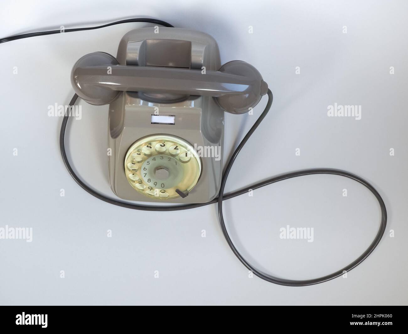 Vintage grey rotary dial analog landline telephone Stock Photo - Alamy