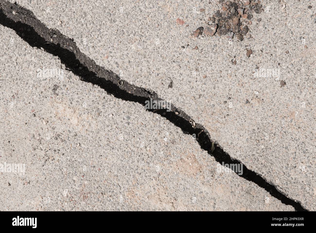 Large crack stratification separation of asphalt road broken damaged ...