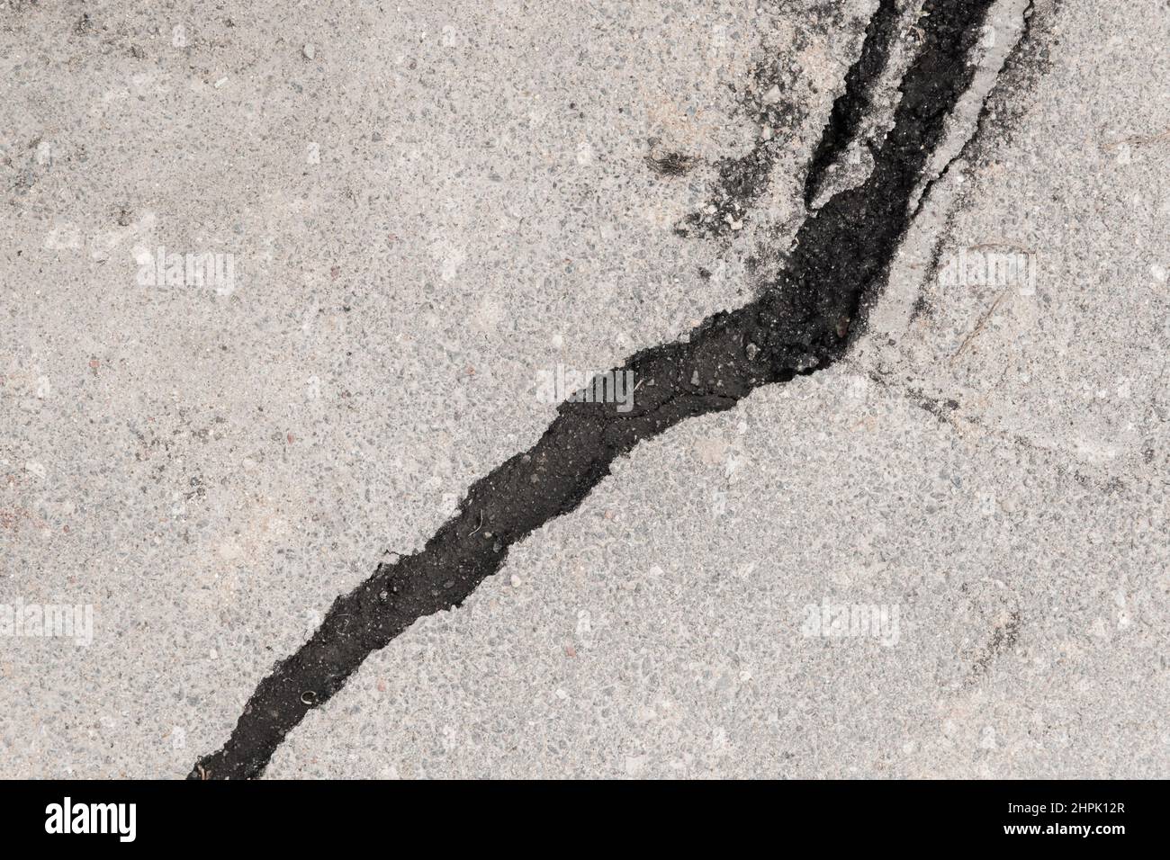 Large crack stratification separation of asphalt road broken damaged ...