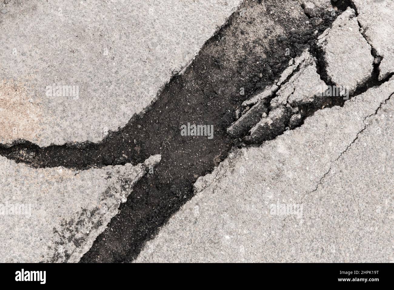 Large crack stratification separation of asphalt road broken damaged ...