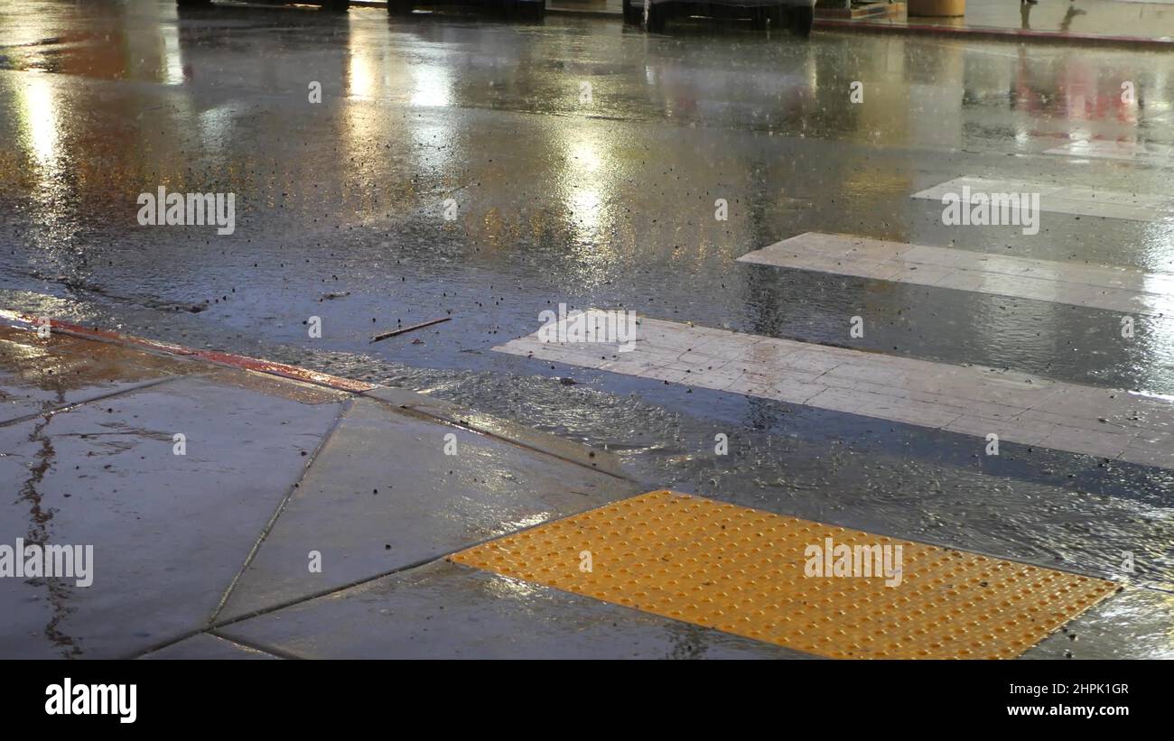 Rain drops on wet asphalt of city street in USA, raindrops falling on ...