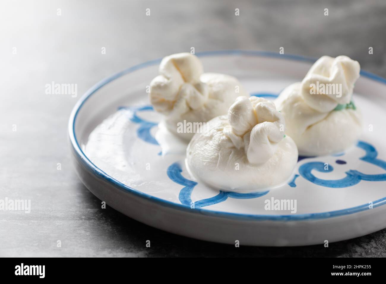 Italian burrata cheese made from mozzarella with cream inside from ...