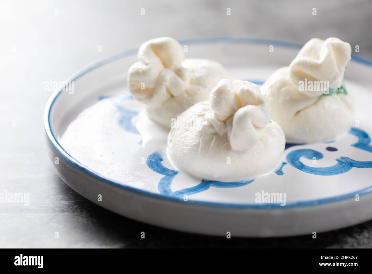 Italian burrata cheese made from mozzarella with cream inside from ...