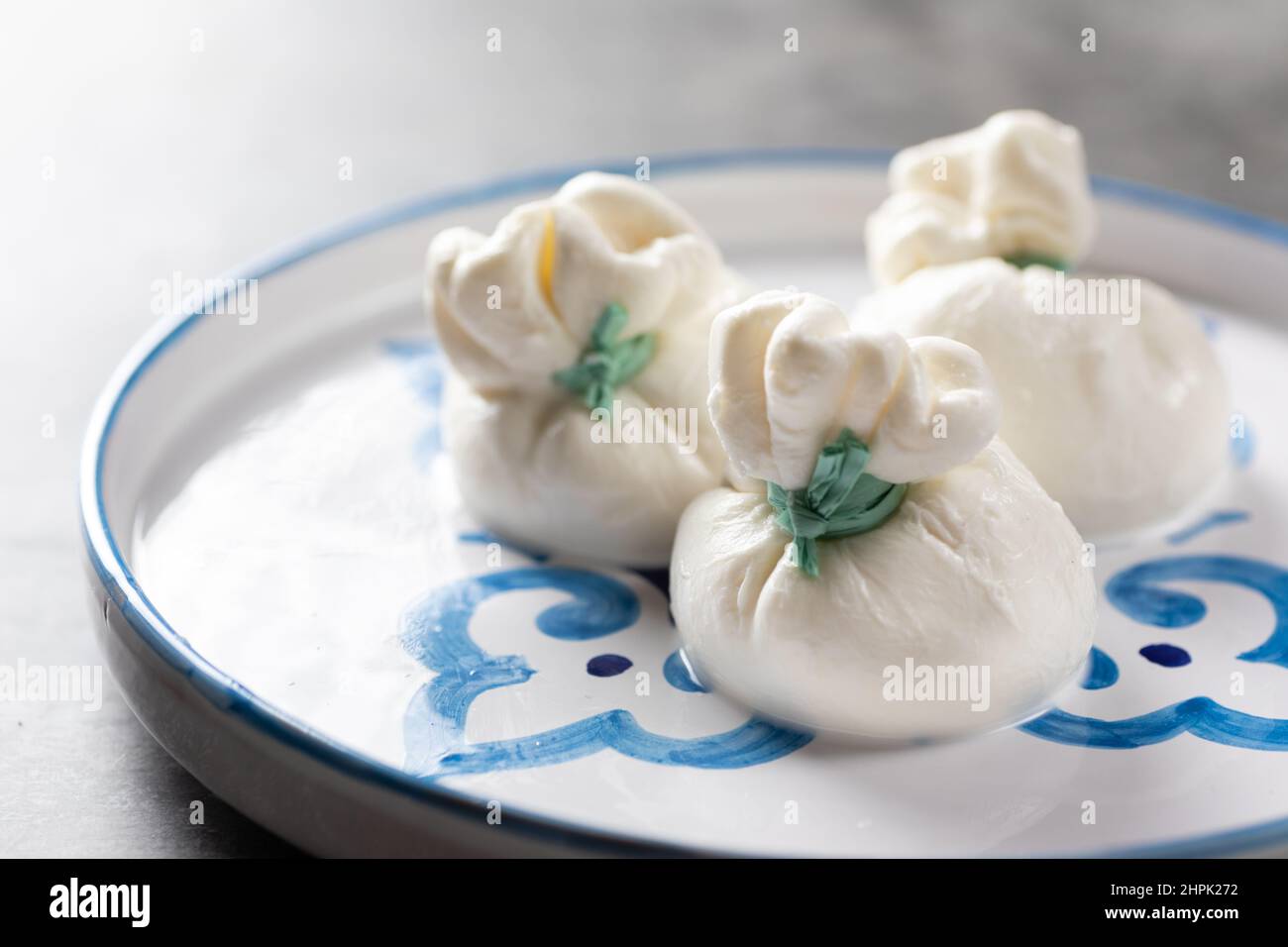 Italian burrata cheese made from mozzarella with cream inside from ...