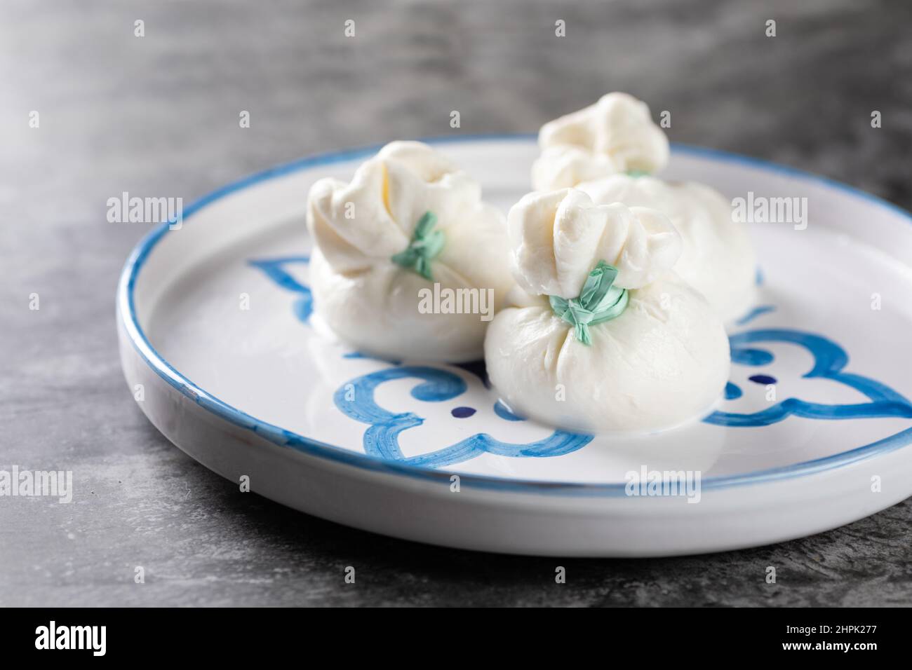 Italian burrata cheese made from mozzarella with cream inside from ...
