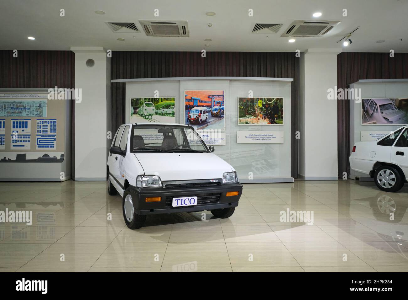 A white TICO small car, produced, made in Uzbekistan at a local factory ...