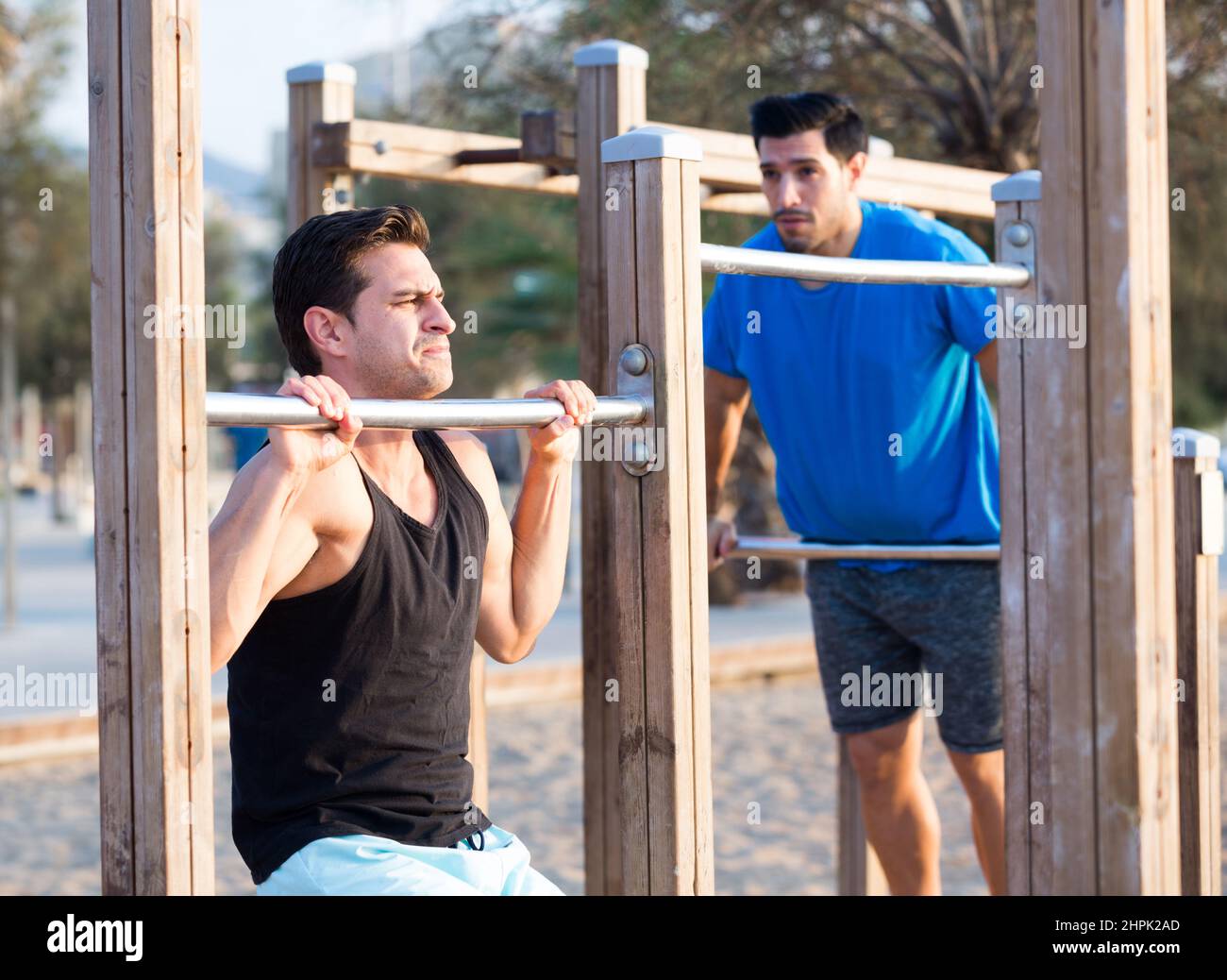 Portrait of sportsmen who are pulling-up Stock Photo - Alamy