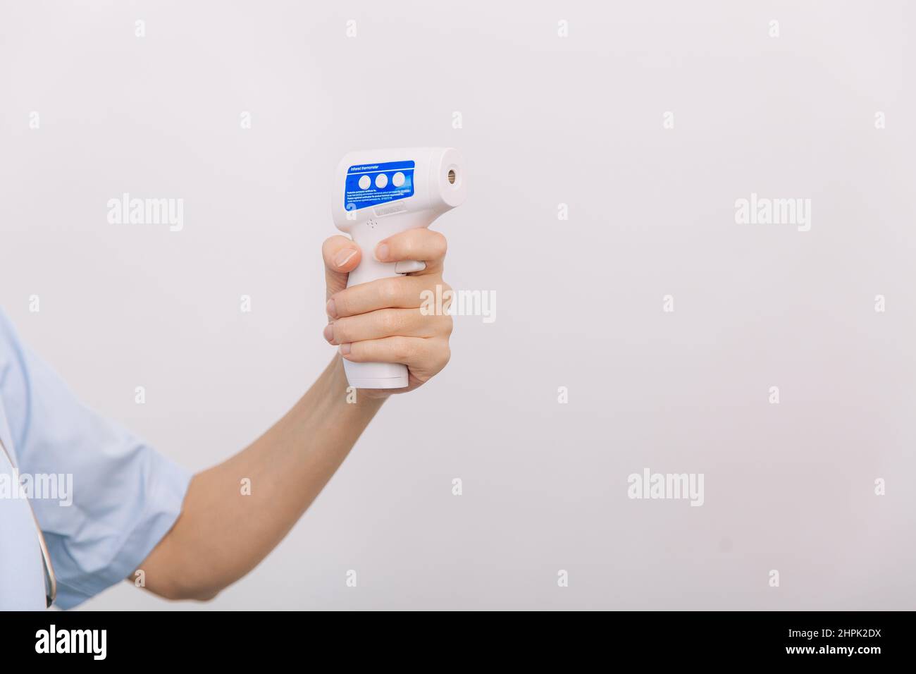Temperature measurement gun in doctor hands. Close-up shot of doctor ...