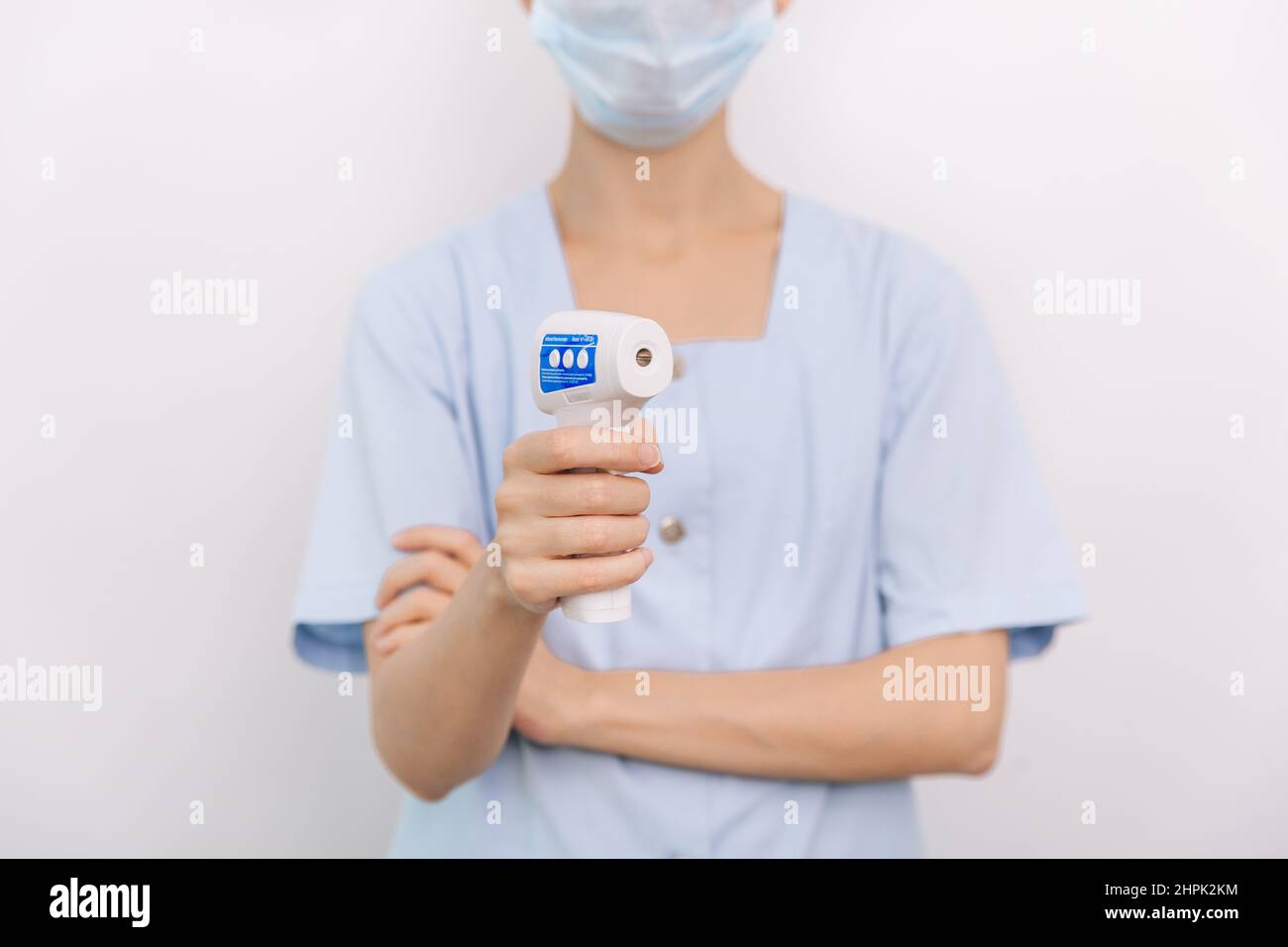 Temperature measurement gun in doctor hands. Close-up shot of doctor ...