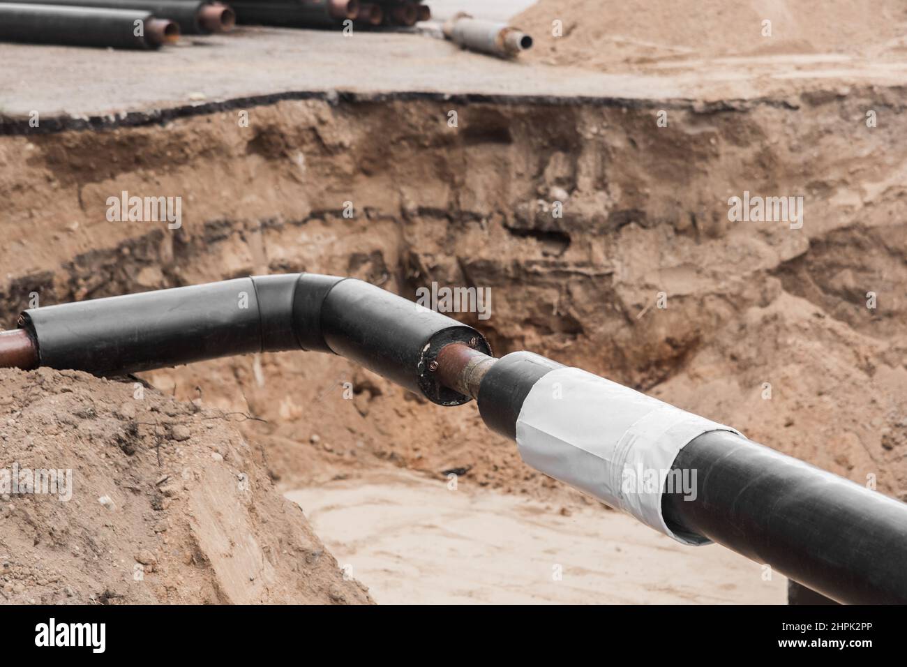 Repair of the water line of the heating main pipe in the ground trench ...