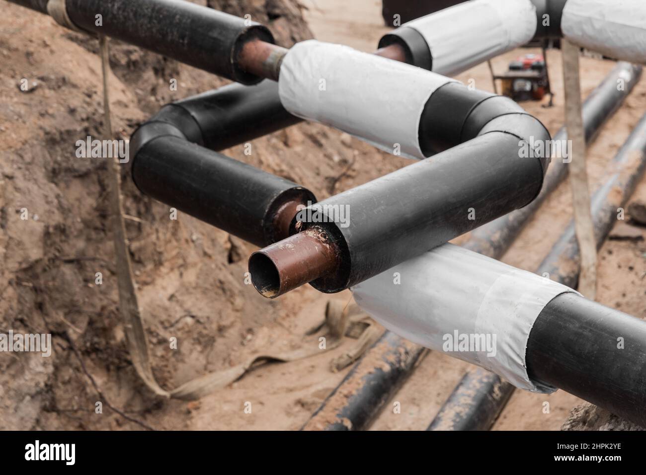 Repair of the water line of the heating main pipe in the ground trench ...