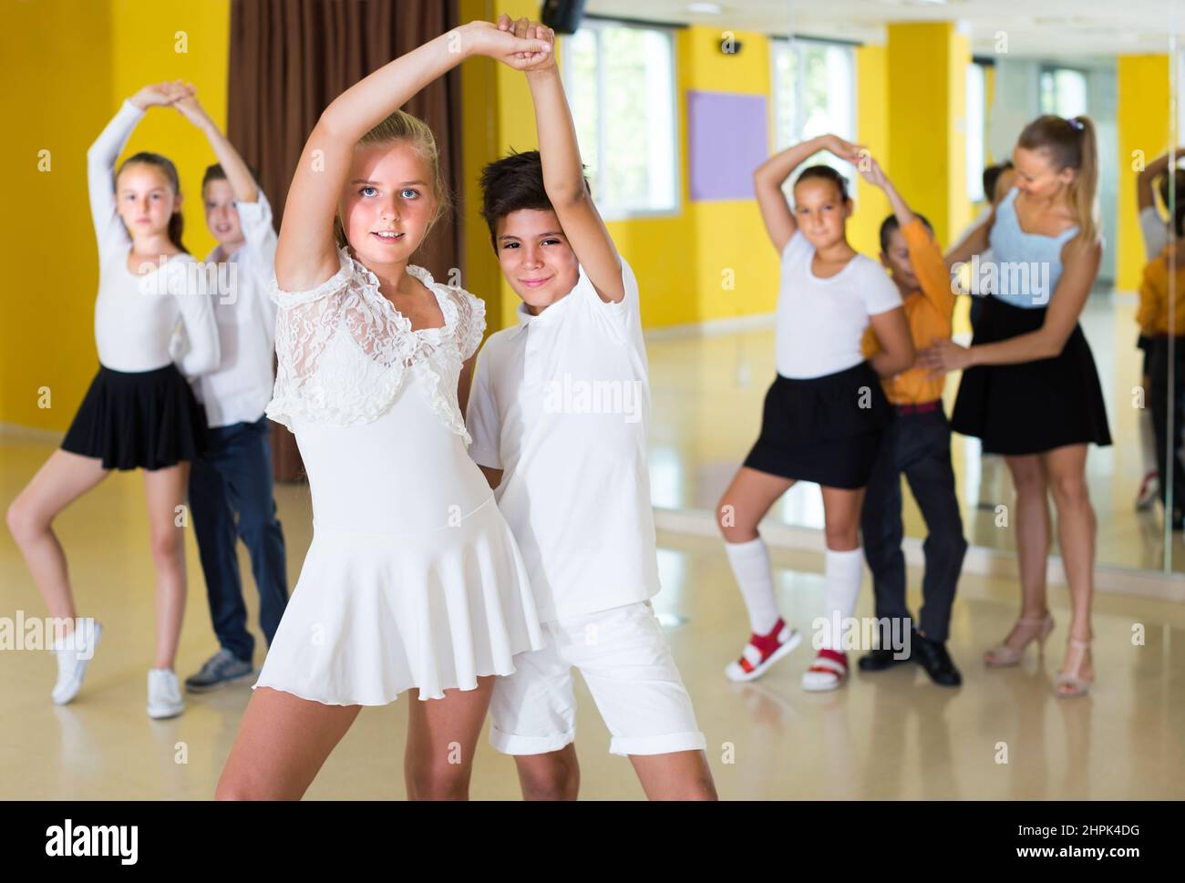 Positive kids are dancing twist in pairs Stock Photo - Alamy
