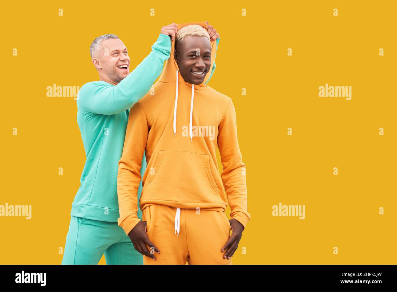 Multi ethnic friends. Two men different color black African-American ...